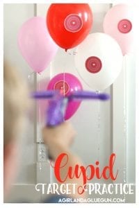 Cupid Target practice. - A girl and a glue gun