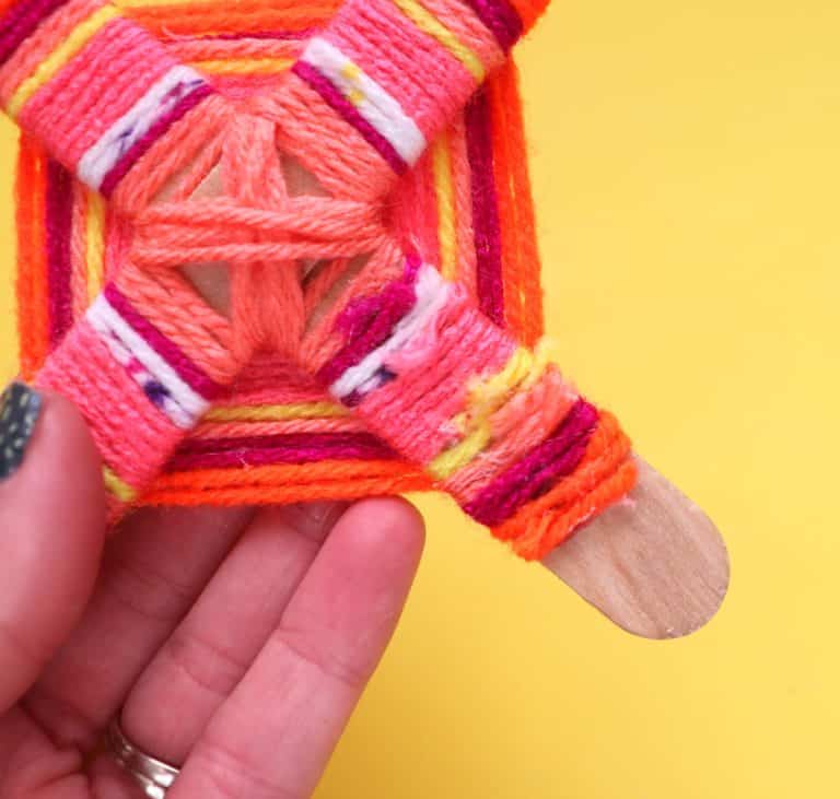 How to make a God's Eye yarn craft. - A girl and a glue gun